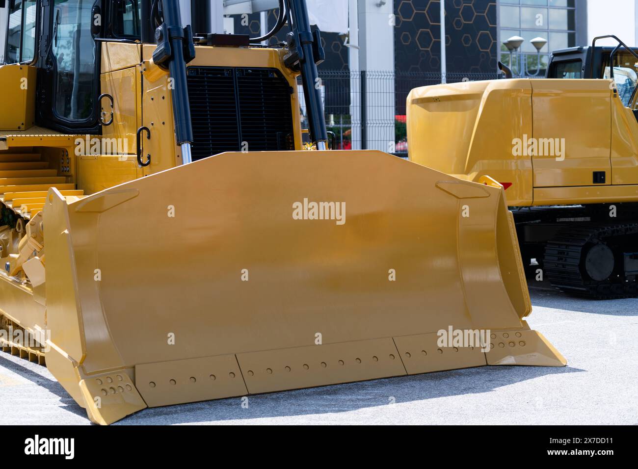 Fleet of yellow construction machines Stock Photo - Alamy