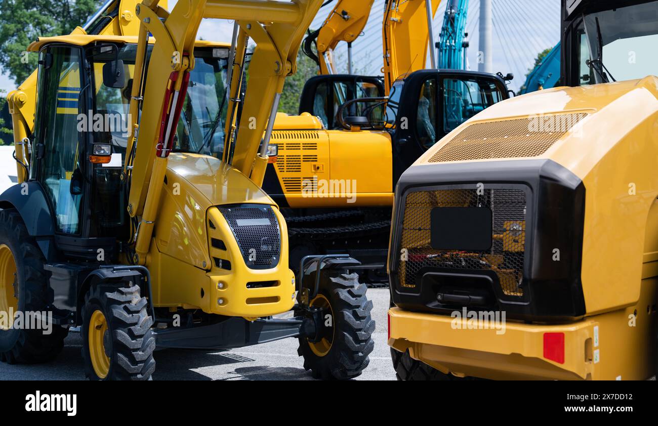 Fleet of yellow construction machines Stock Photo - Alamy