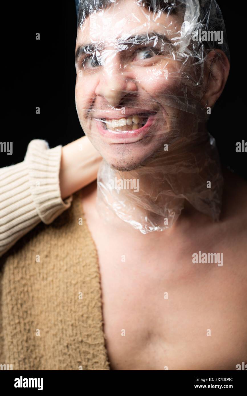 Man transparent piece of plastic surrounded his head. Plastic pollution ...