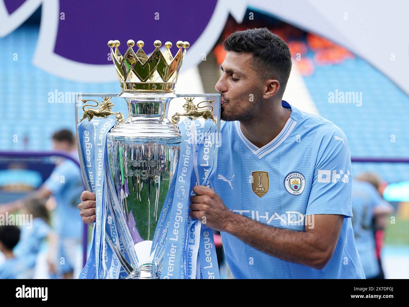 Manchester City's Rodri kisses the Premier League trophy after the ...