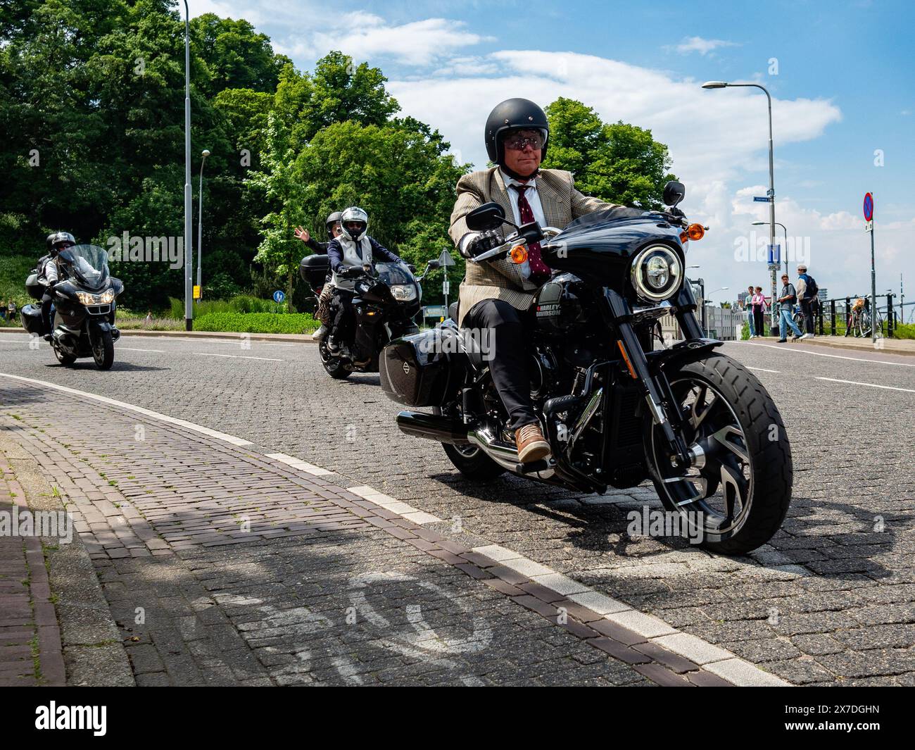 People ride motorbikes. The Distinguished Gentleman's Ride unites ...