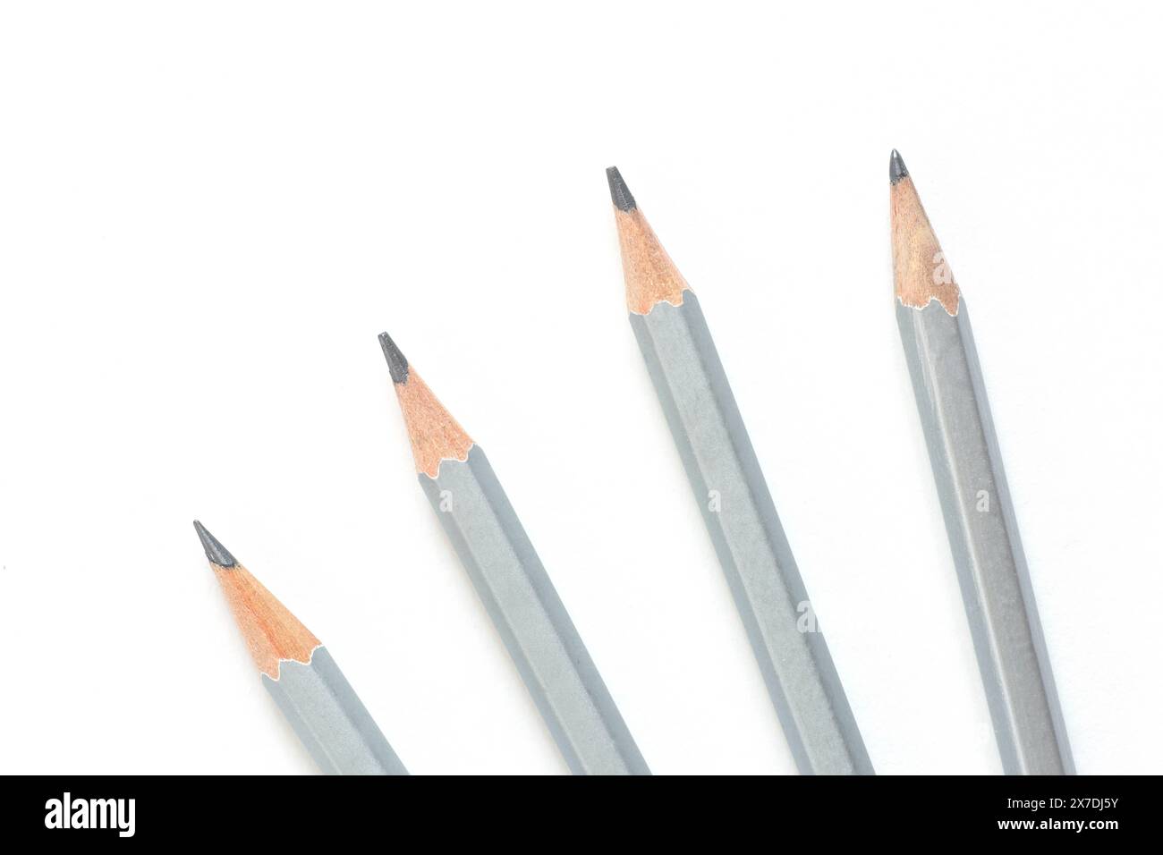 four crayon pencils isolated on white background Stock Photo - Alamy