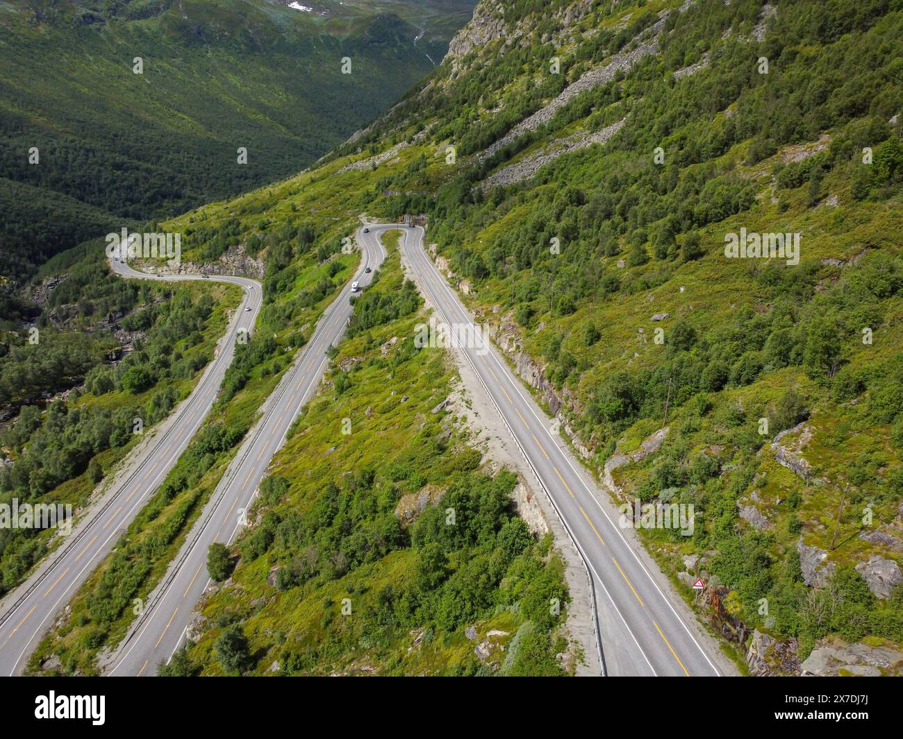 Borlaug, Norway. Cars Goes On Serpentine Mountain Road . Famous ...