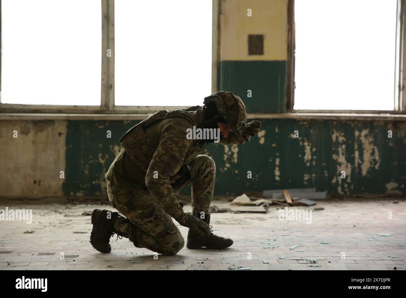 Military mission. Soldier in uniform inside abandoned building, space ...