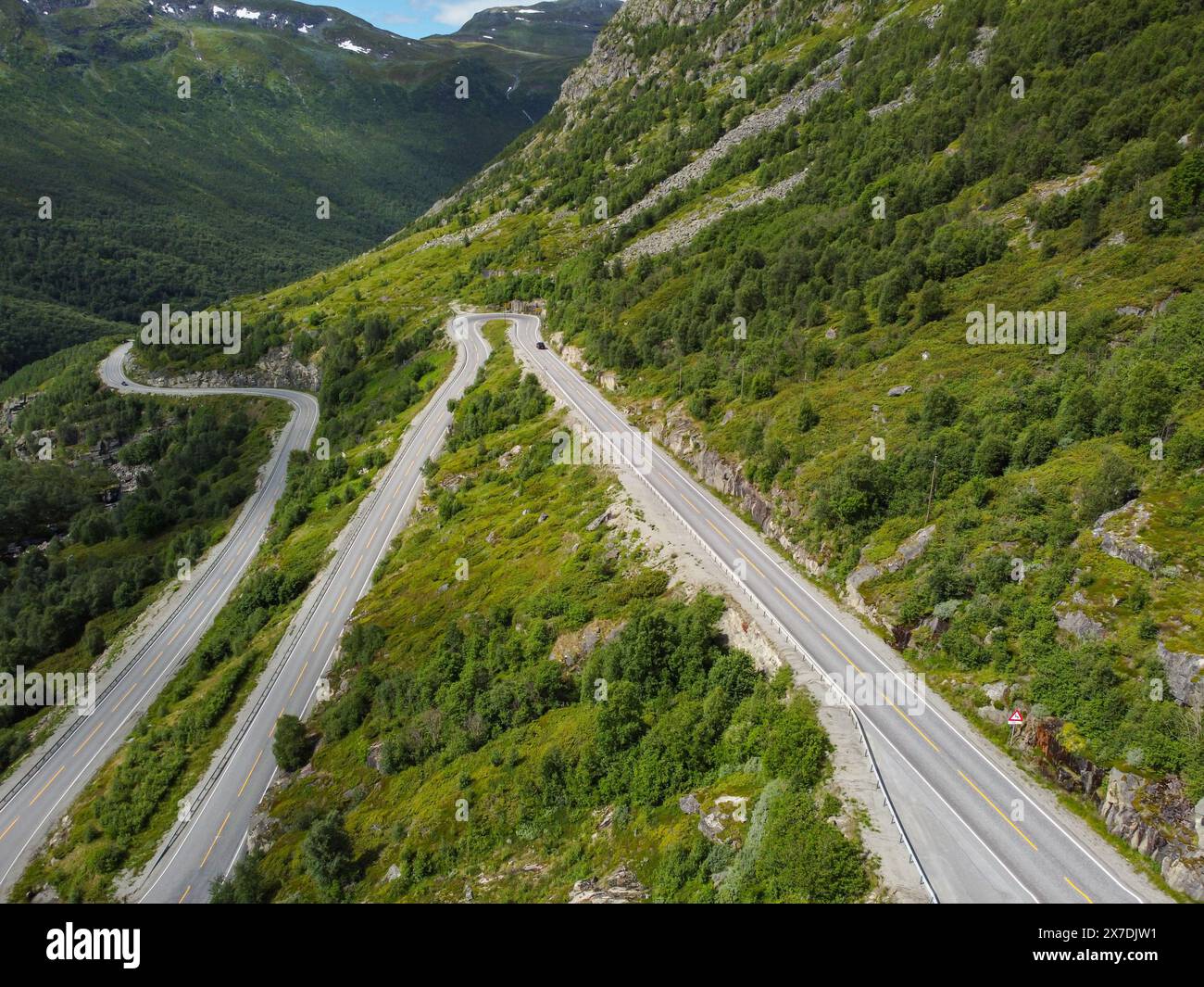 Borlaug, Norway. Cars Goes On Serpentine Mountain Road . Famous ...