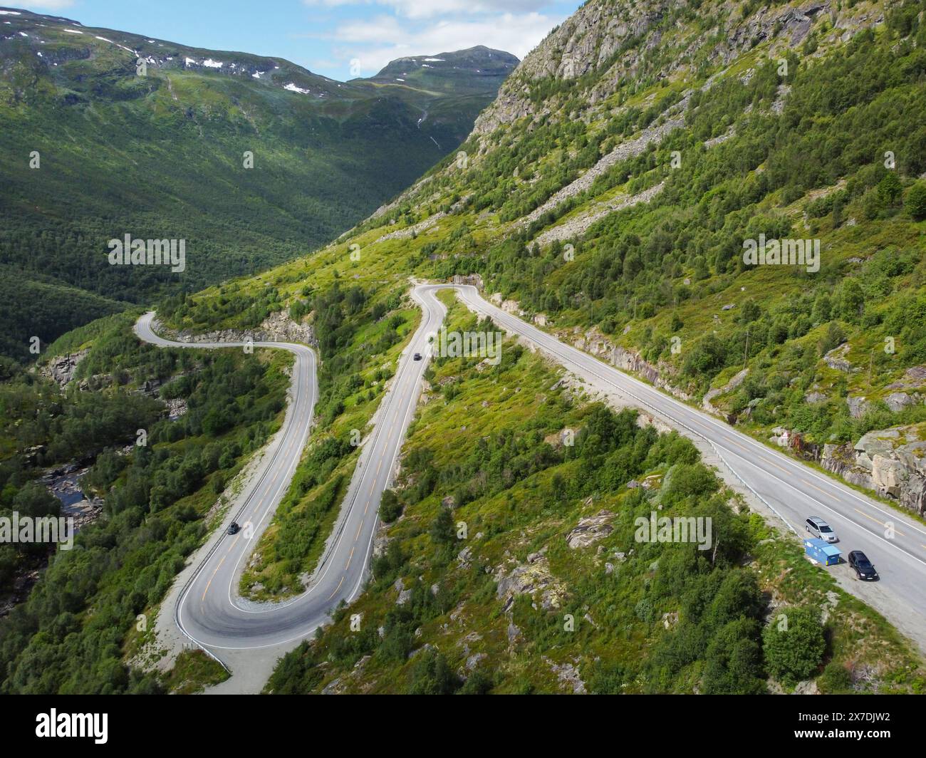 Borlaug, Norway. Cars Goes On Serpentine Mountain Road . Famous ...