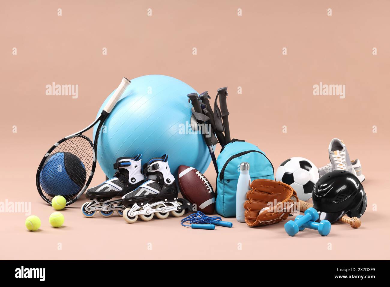 Many different sports equipment on beige background Stock Photo - Alamy