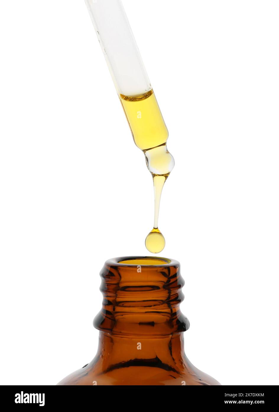Dripping tincture from pipette into bottle isolated on white Stock ...