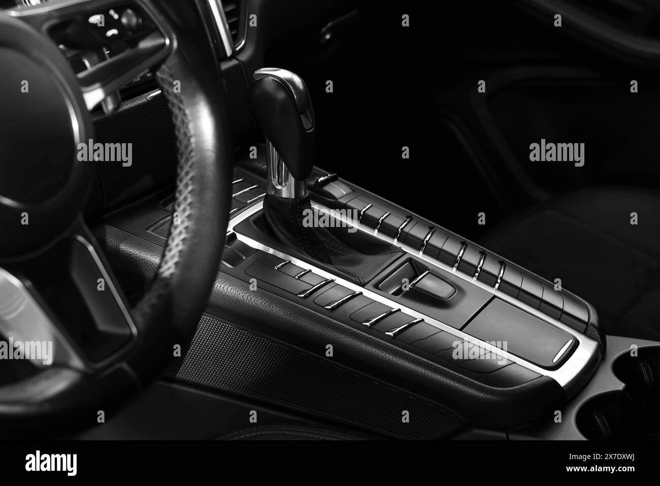 Gear stick and steering wheel inside of modern black car Stock Photo ...
