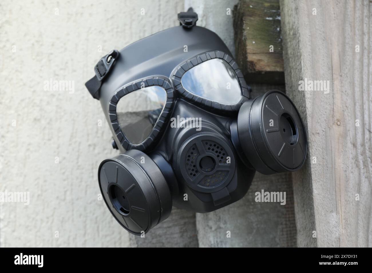 One gas mask hanging on building outdoors. Safety equipment Stock Photo ...