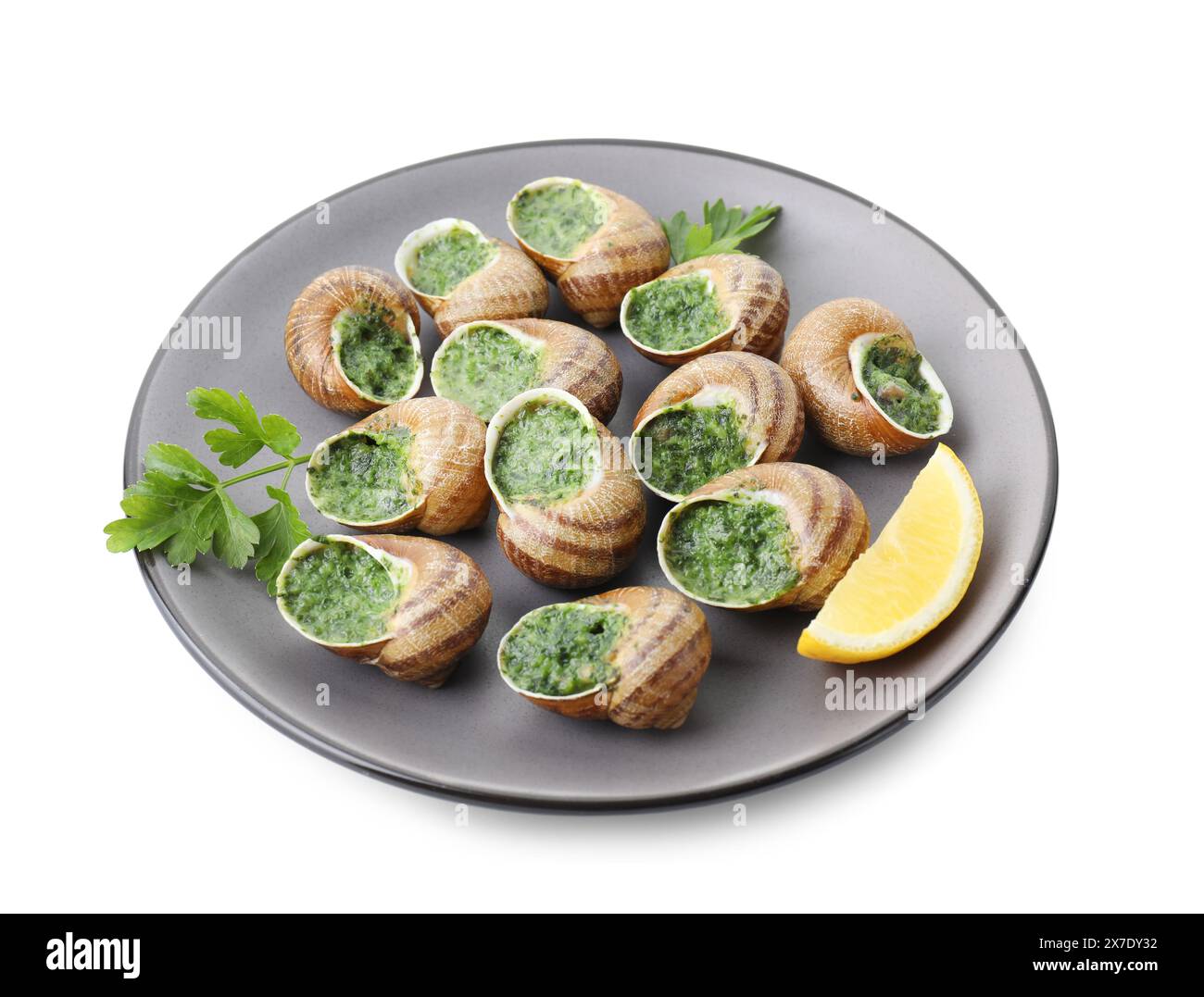 Delicious cooked snails with parsley and lemon isolated on white Stock ...