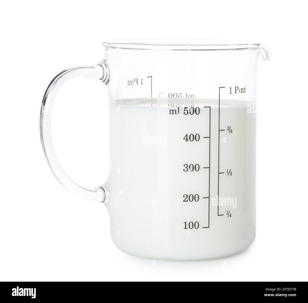 Fresh milk in measuring cup isolated on white Stock Photo - Alamy