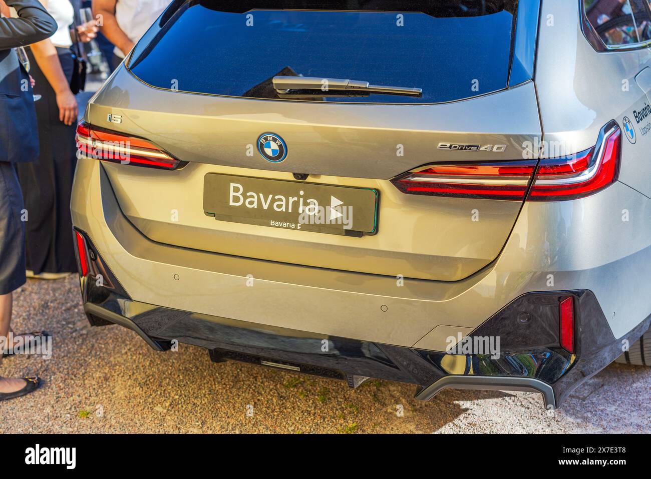 Close-up rear view of the new BMW i5 electric car during a public ...