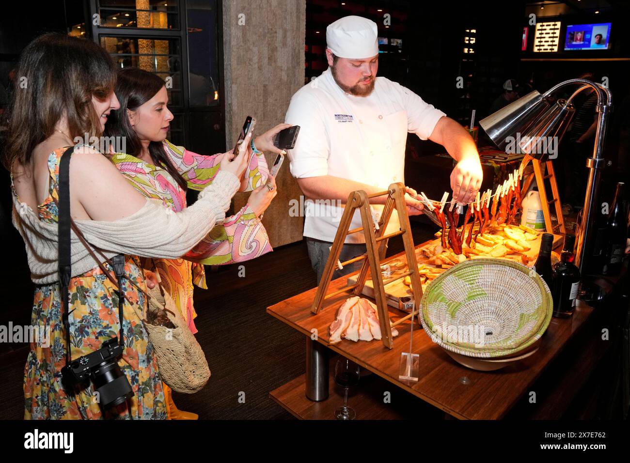 IMAGE DISTRIBUTED FOR KALAHARI RESORTS - Guests take a photo of the hanging bacon station in ...