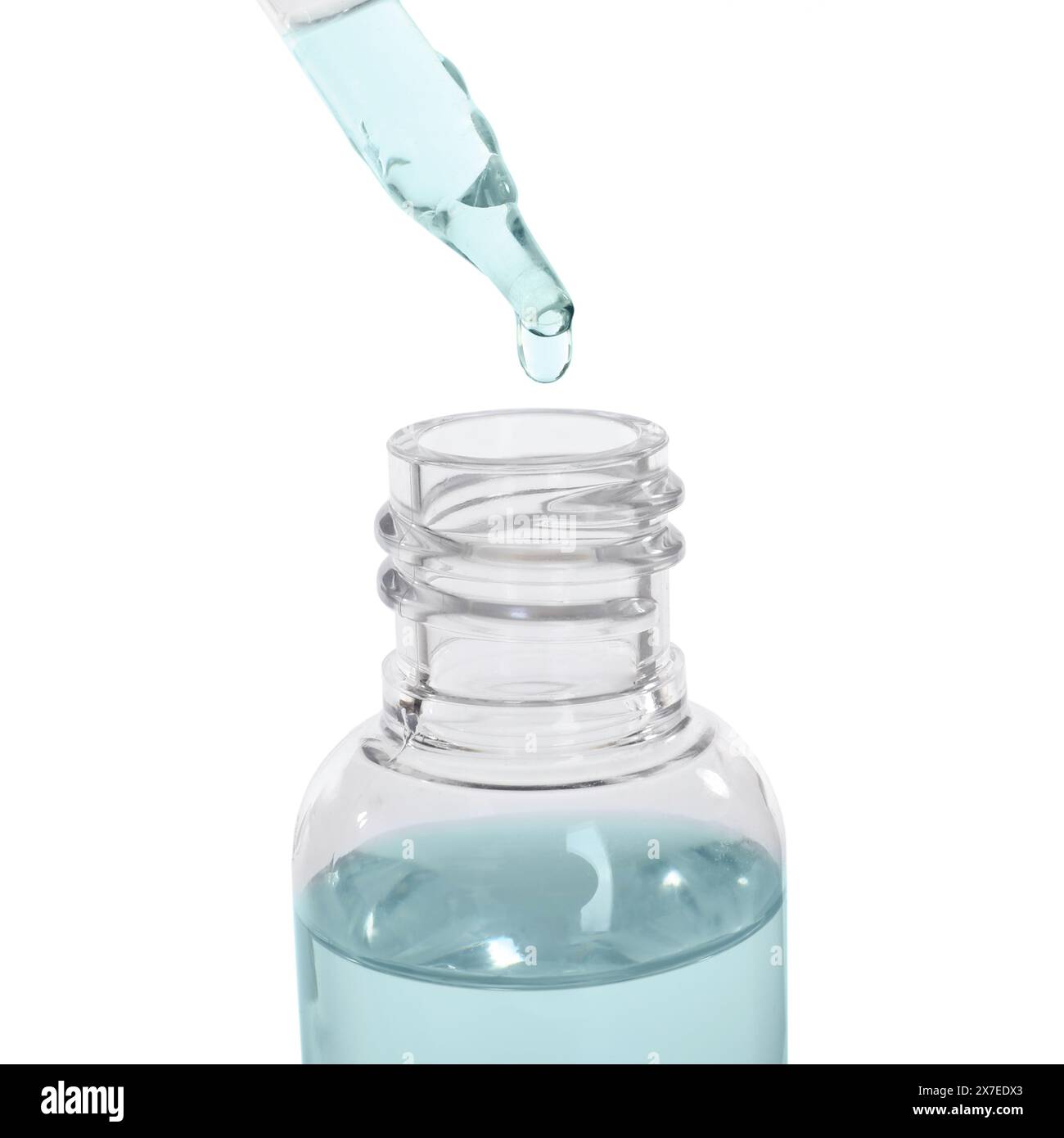 Dripping medical drops into bottle on white background Stock Photo - Alamy