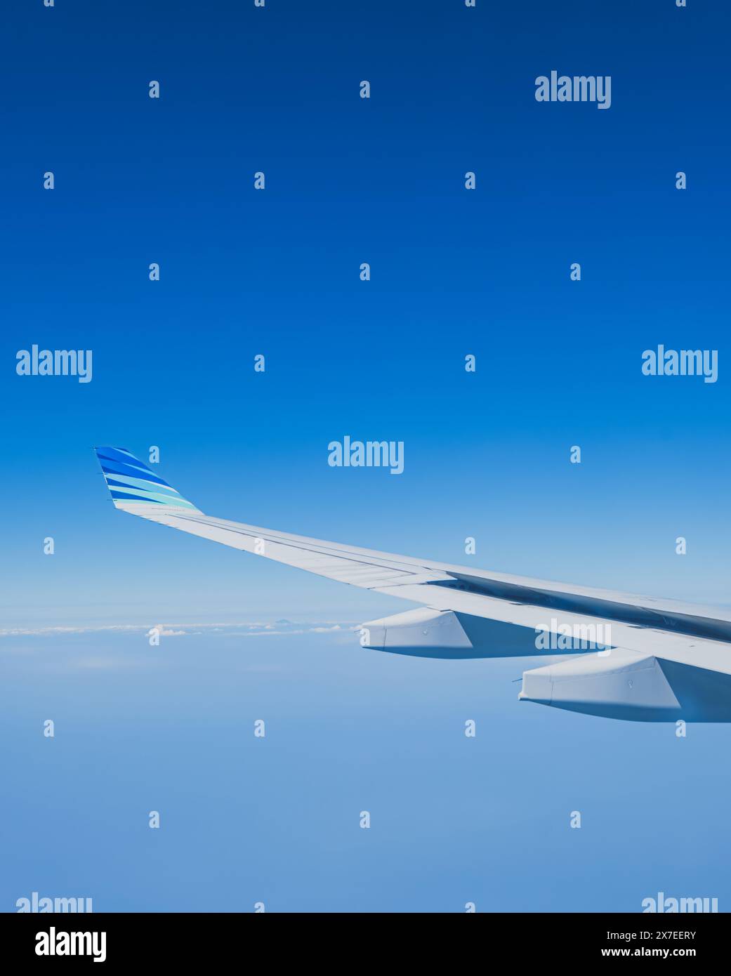 Balikpapan, Indonesia - May 6th, 2024. The wing of a Garuda Indonesia ...