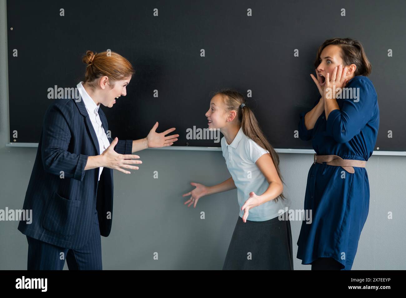 A female teacher and a student's mother yell at each other at the ...