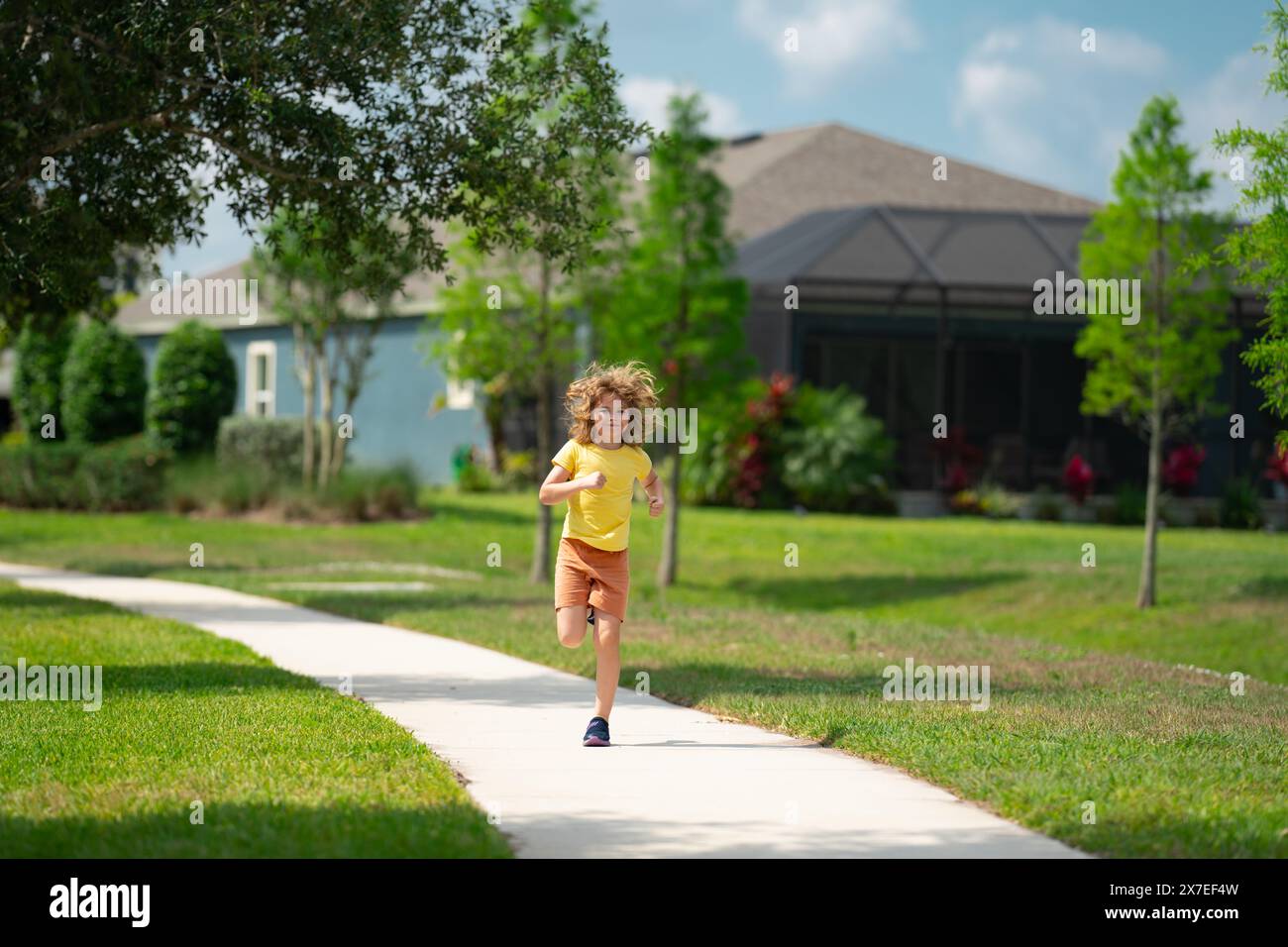 Kid running in summer street. Child enjoy run. Little boy running on ...