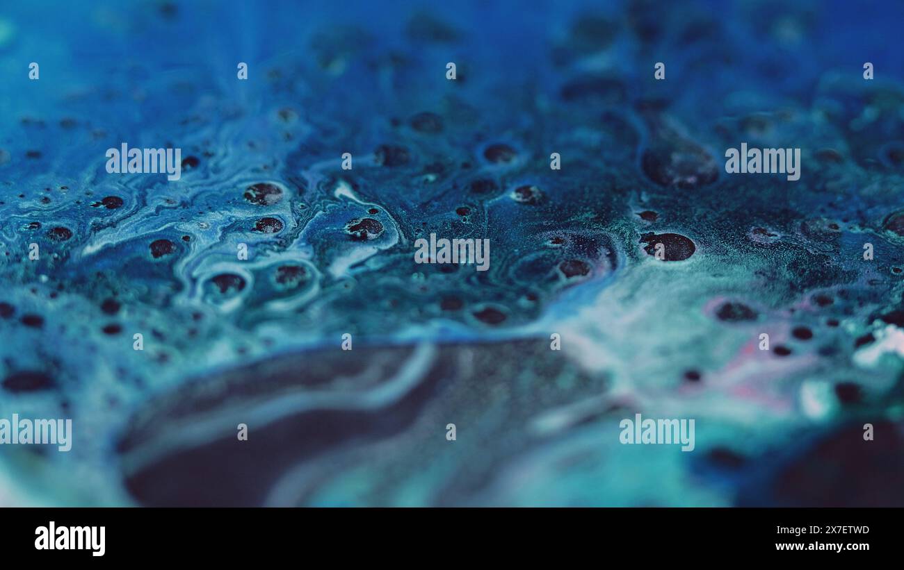 Glitter paint splash. Oil bubbles. Defocused blue pink black color ...