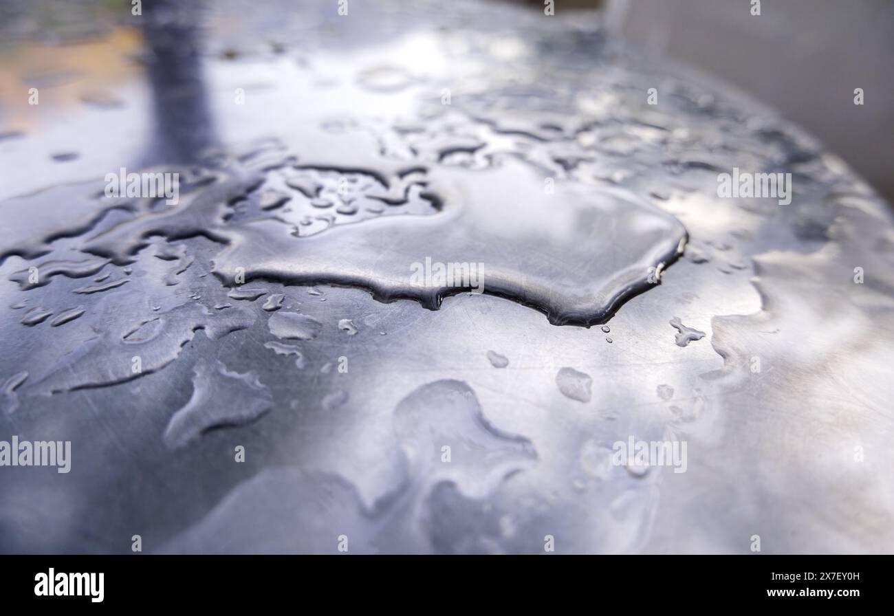 Detail of wet steel surface with rain drops Stock Photo - Alamy