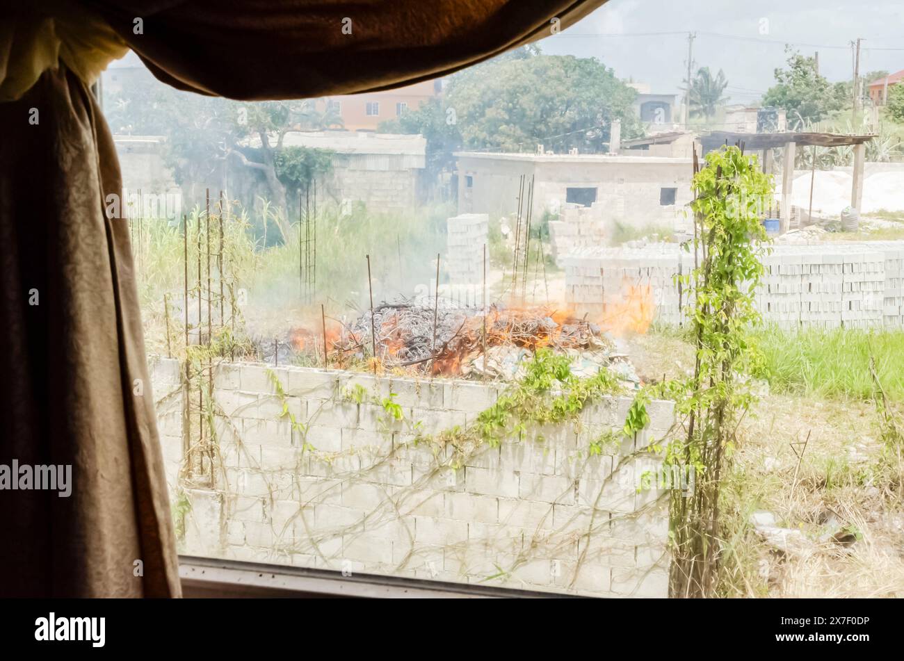 Window View of a Small Fire Stock Photo - Alamy