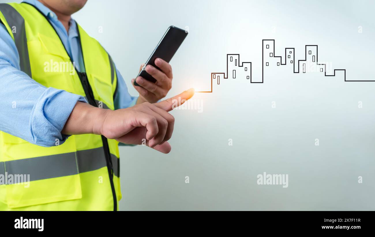 Civil engineer architect Using a smartphone to communicate and give ...