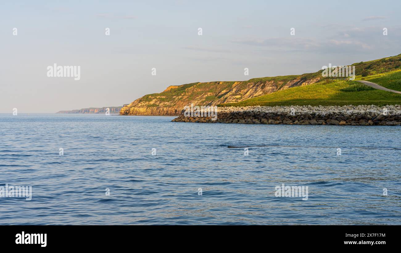 North Sea coast and cliffs at South Bay in Scarborough, North Yorkshire ...