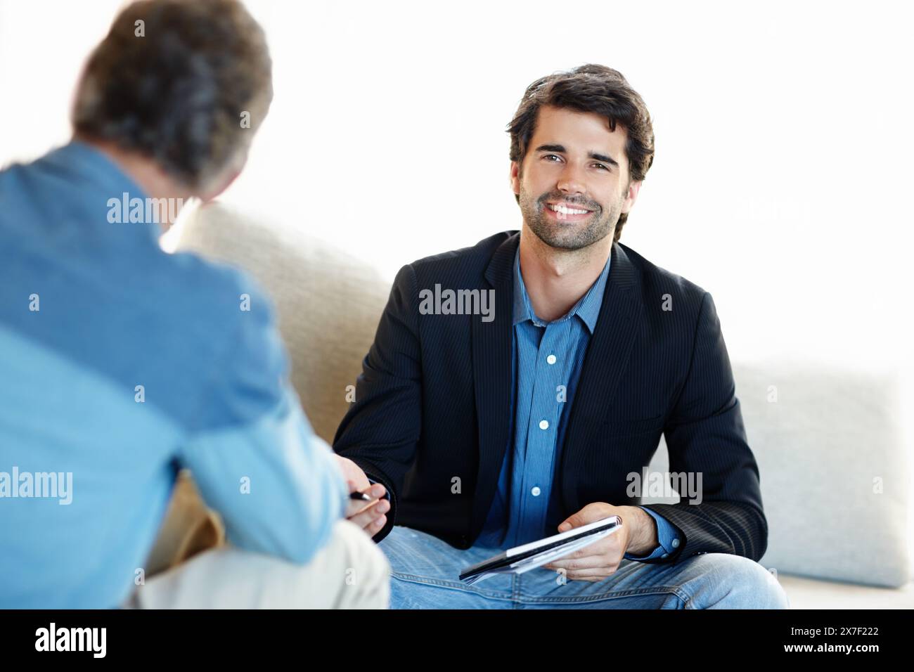 Portrait, psychologist and happy man with client in office for mental ...