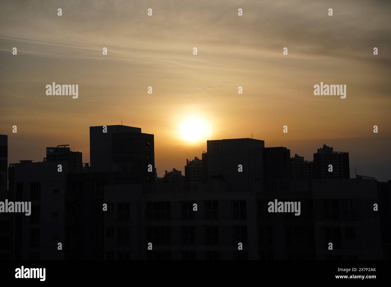 Silhouette of an apartment building at sunset Stock Photo - Alamy
