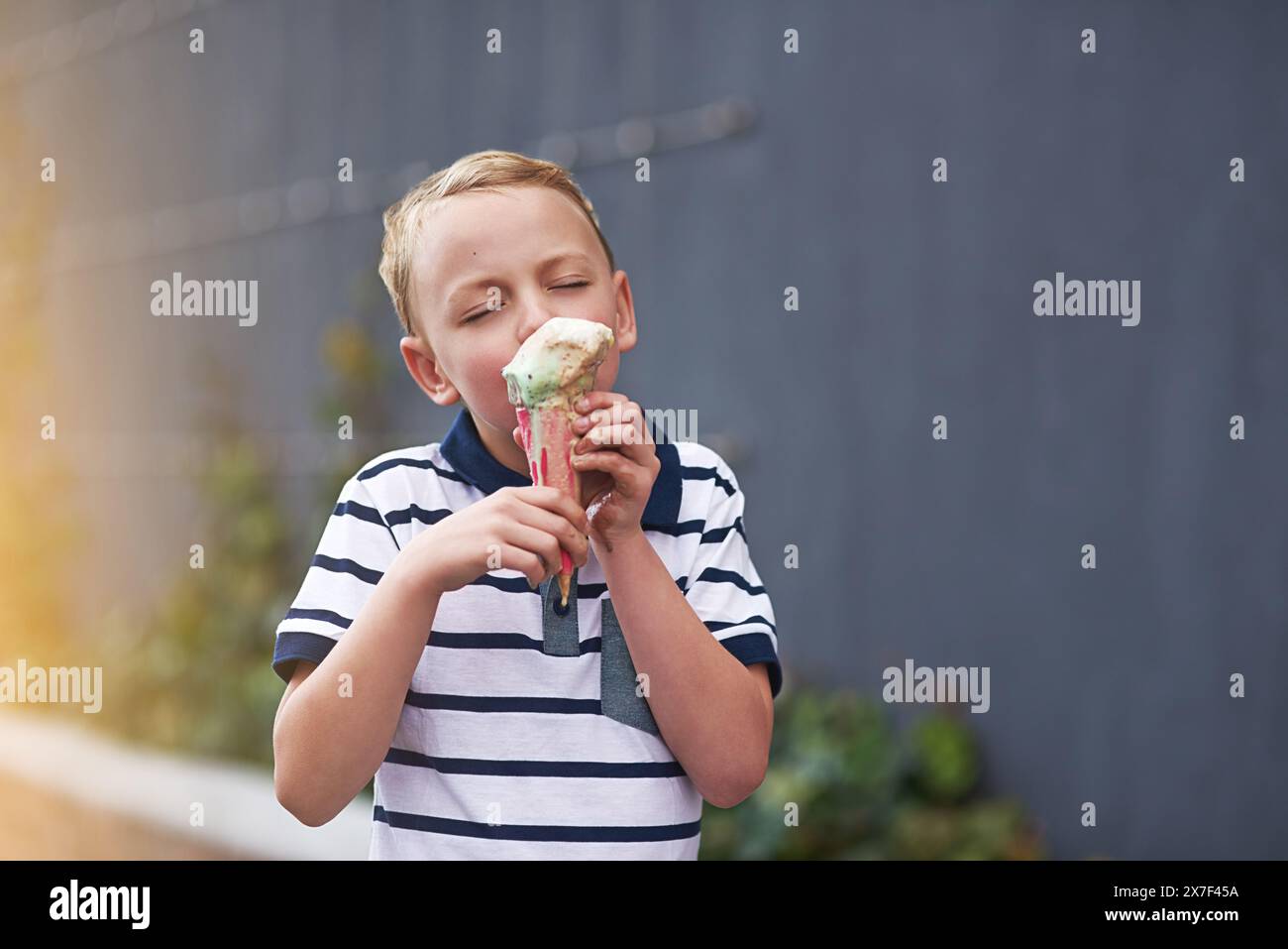 Ice cream, outdoor and kid in store for dessert, craving or sweet treat ...