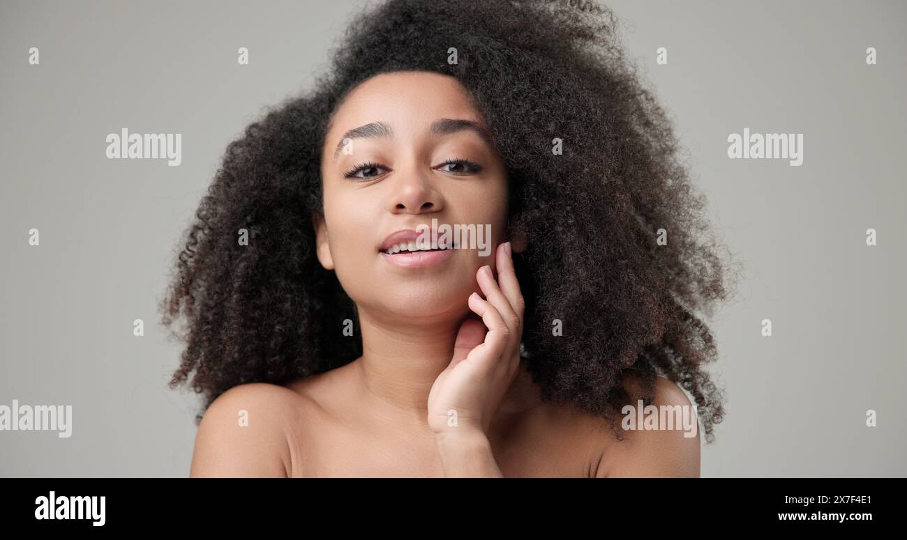Beauty and healthcare concept - beautiful African American woman with ...