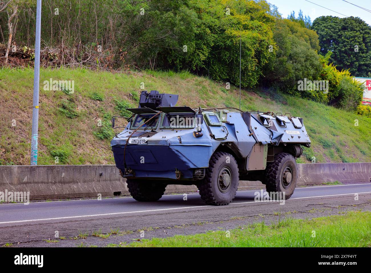Mon, May 20 - Dumbea - Gendarmerie armored vehicle moving towards a ...
