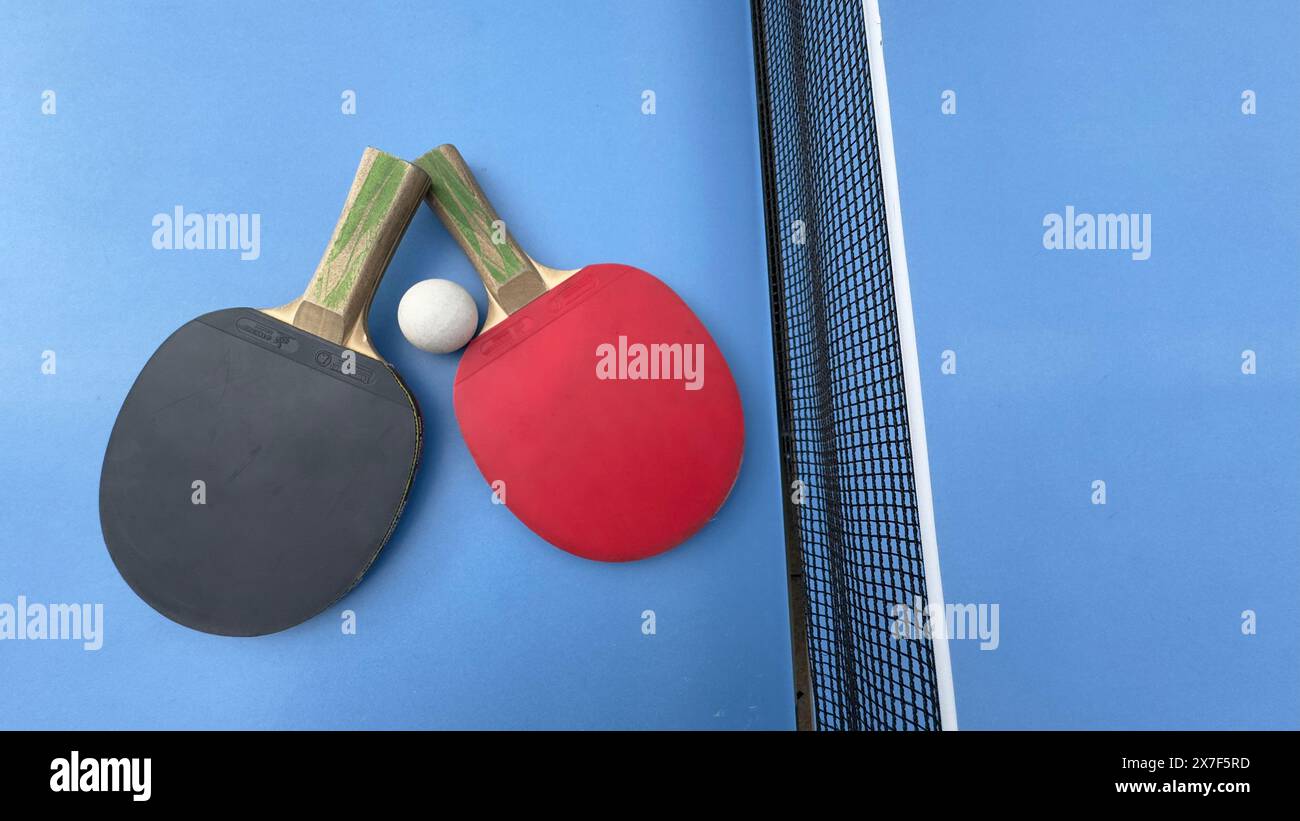 Table tennis rackets and ball on tennis table Stock Photo - Alamy