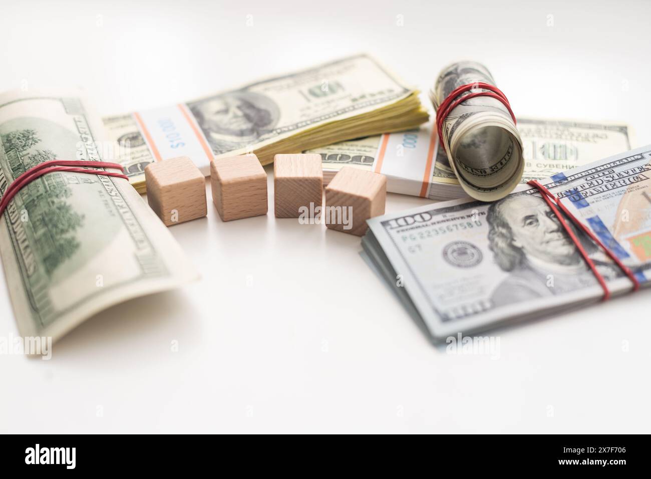 roles dollar notes in front of white background Stock Photo - Alamy