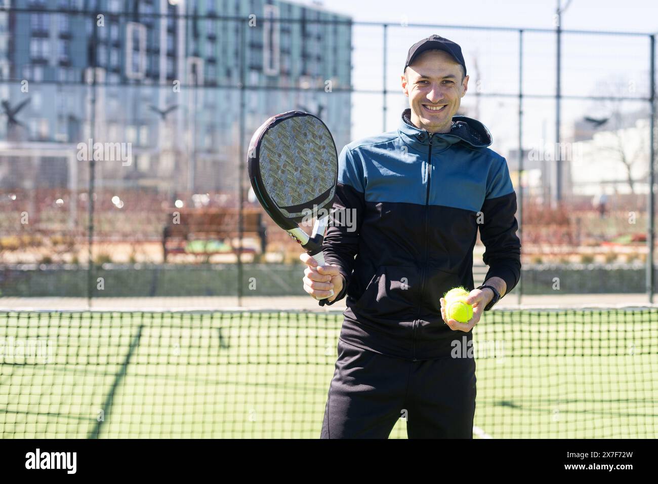 paddle player resting against the wall entertained by the ball Stock ...