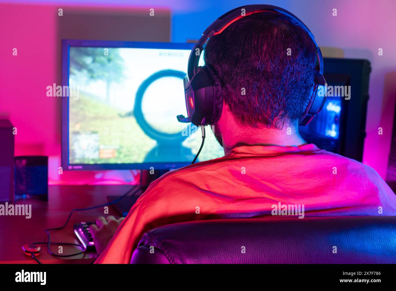 A gamer deeply focused on the game, displaying intense concentration ...