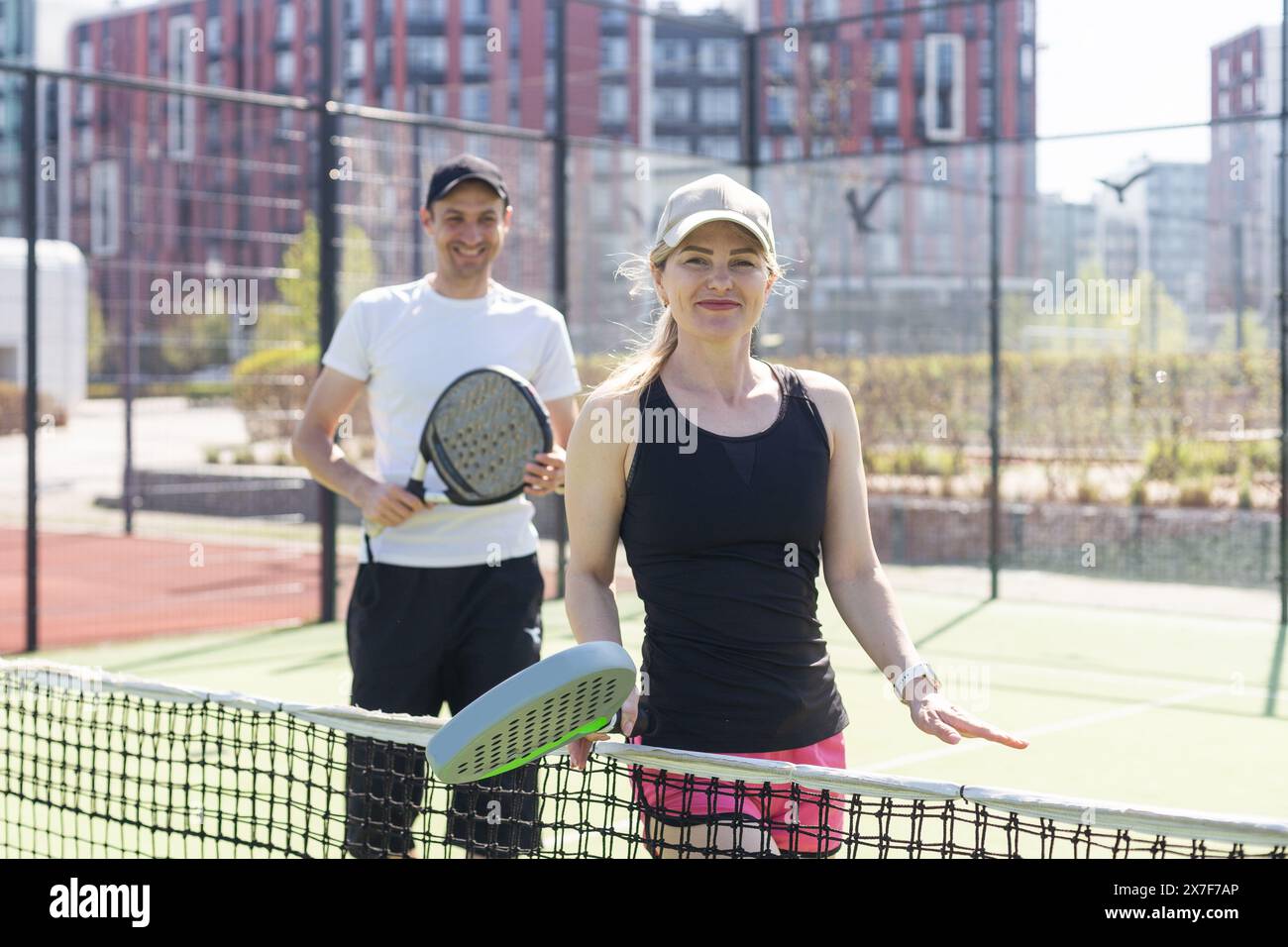 paddle tennis couple players ready for class Stock Photo - Alamy