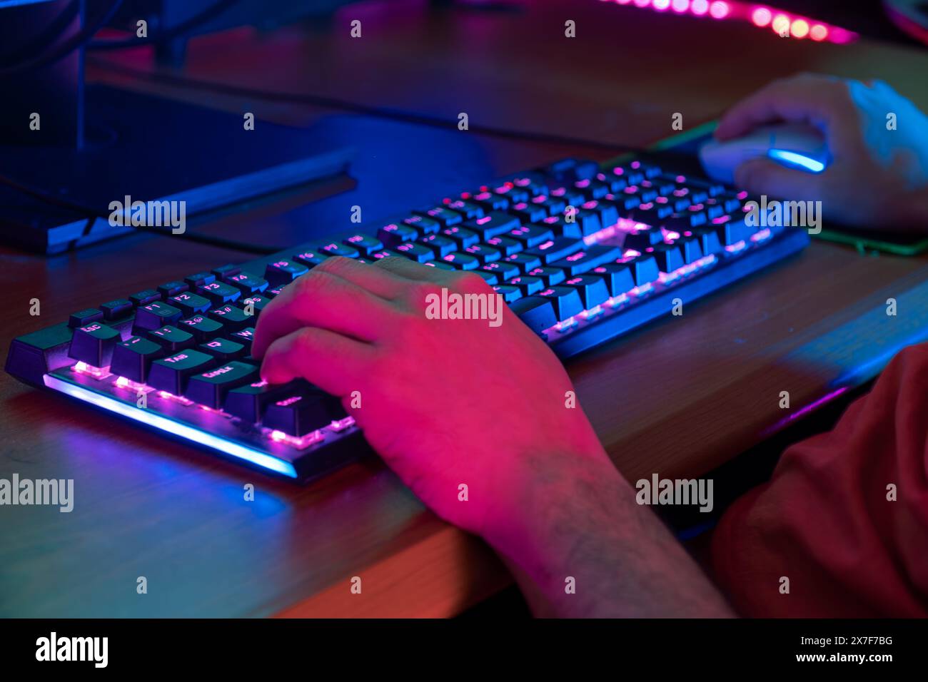 A gamer engaged in gameplay, surrounded by a vibrant and colorful setup ...