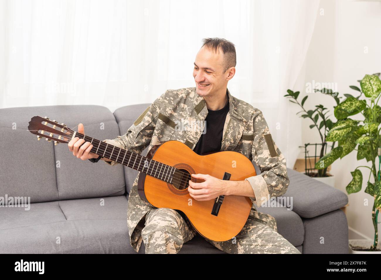 Veteran Guitar Play Concept. Family Meeting. Camouflage Uniform ...