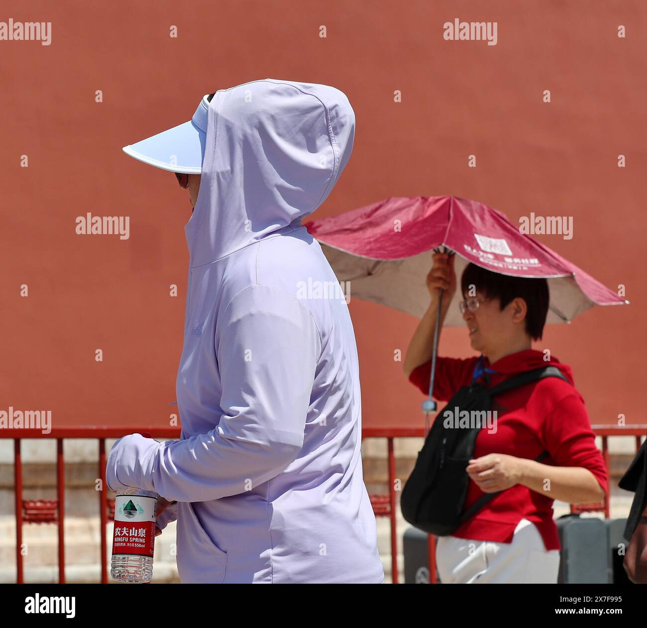 Tourists visit the Palace Museum amid hot weather in Beijing, China, 17 ...