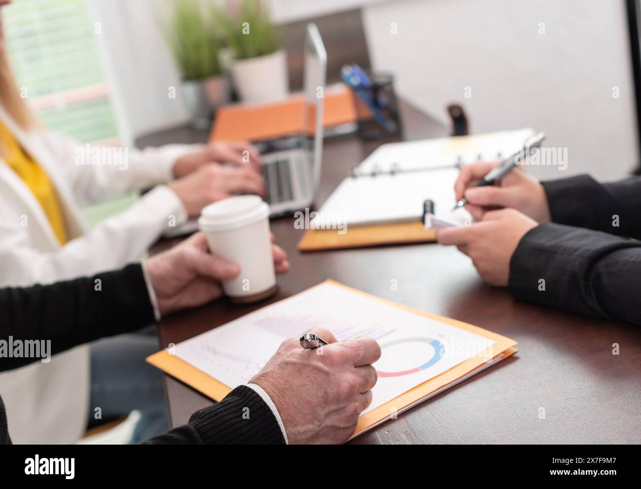 Group of three people working together. Teamwork concept Stock Photo ...