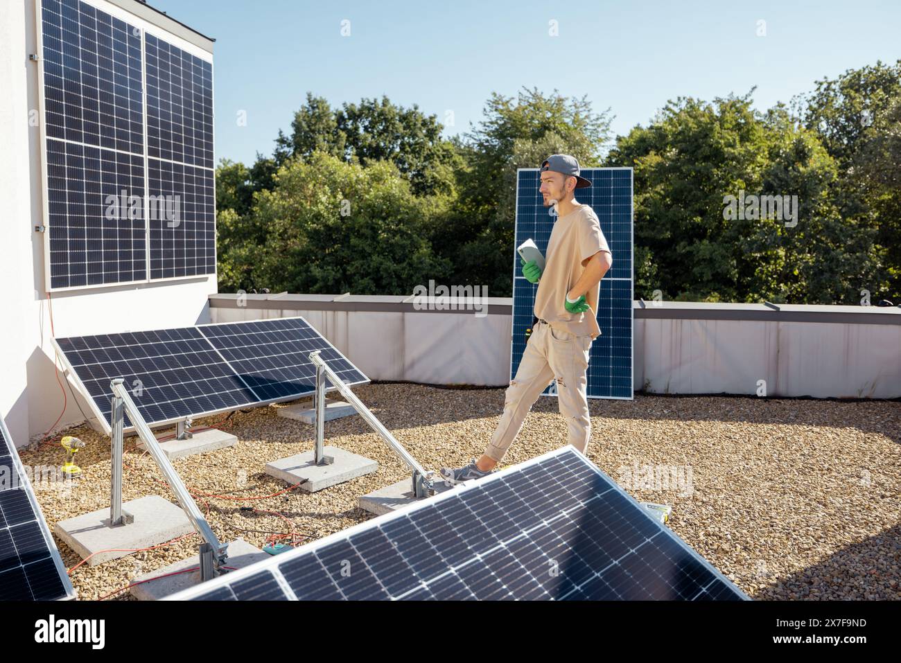 Man looks on solar power station during installation process Stock ...