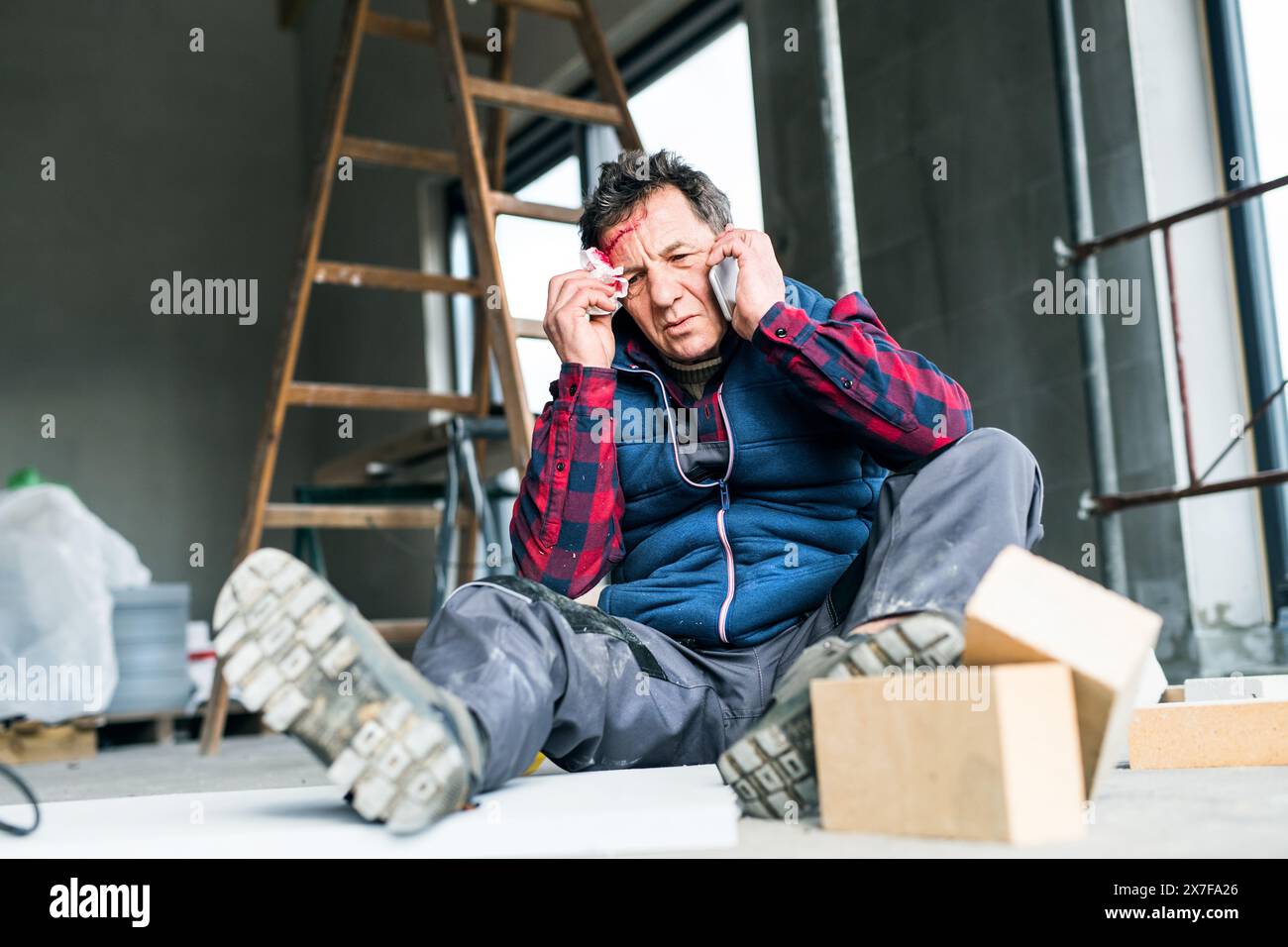 Injured worker with wound on head, head injury. Work injury, accident ...