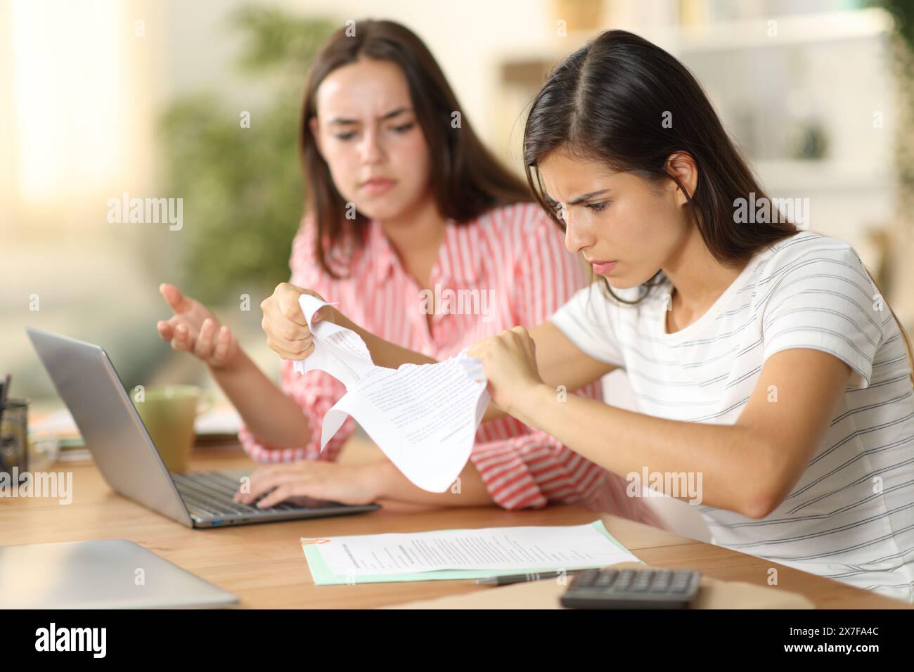 Angry tele workers breaking bad contract working at home Stock Photo ...