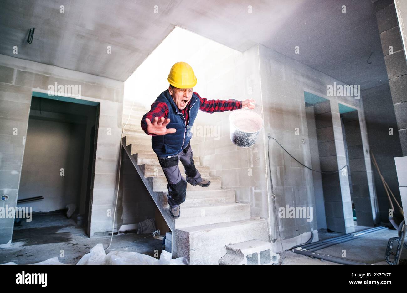 Man falling down the stairs. Accident of a man worker at the ...