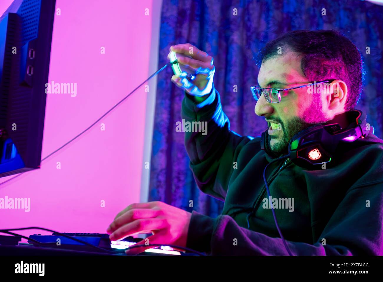 Streamer Angry computer gamer man yells and breaks keyboard after being ...