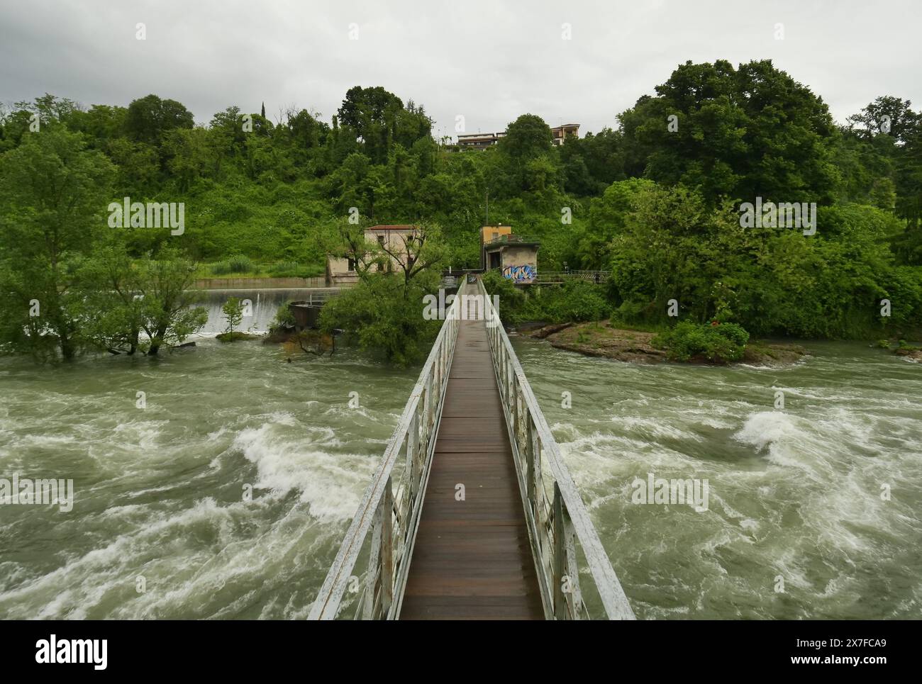 Pedestrian bridge over the Adda river in flood after rain Stock Photo ...