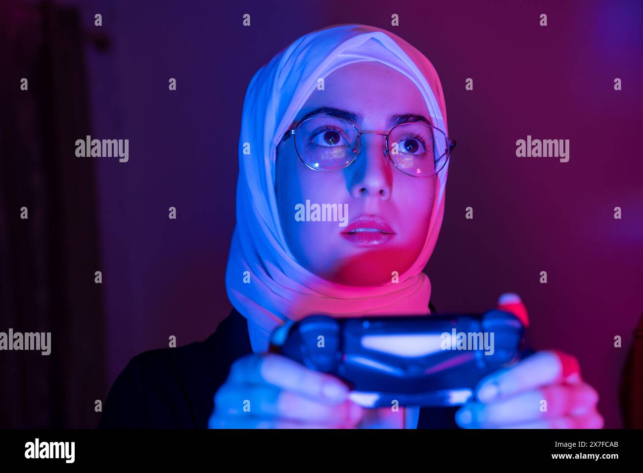 Gamer, headphones and portrait of woman in home at night in neon light ...
