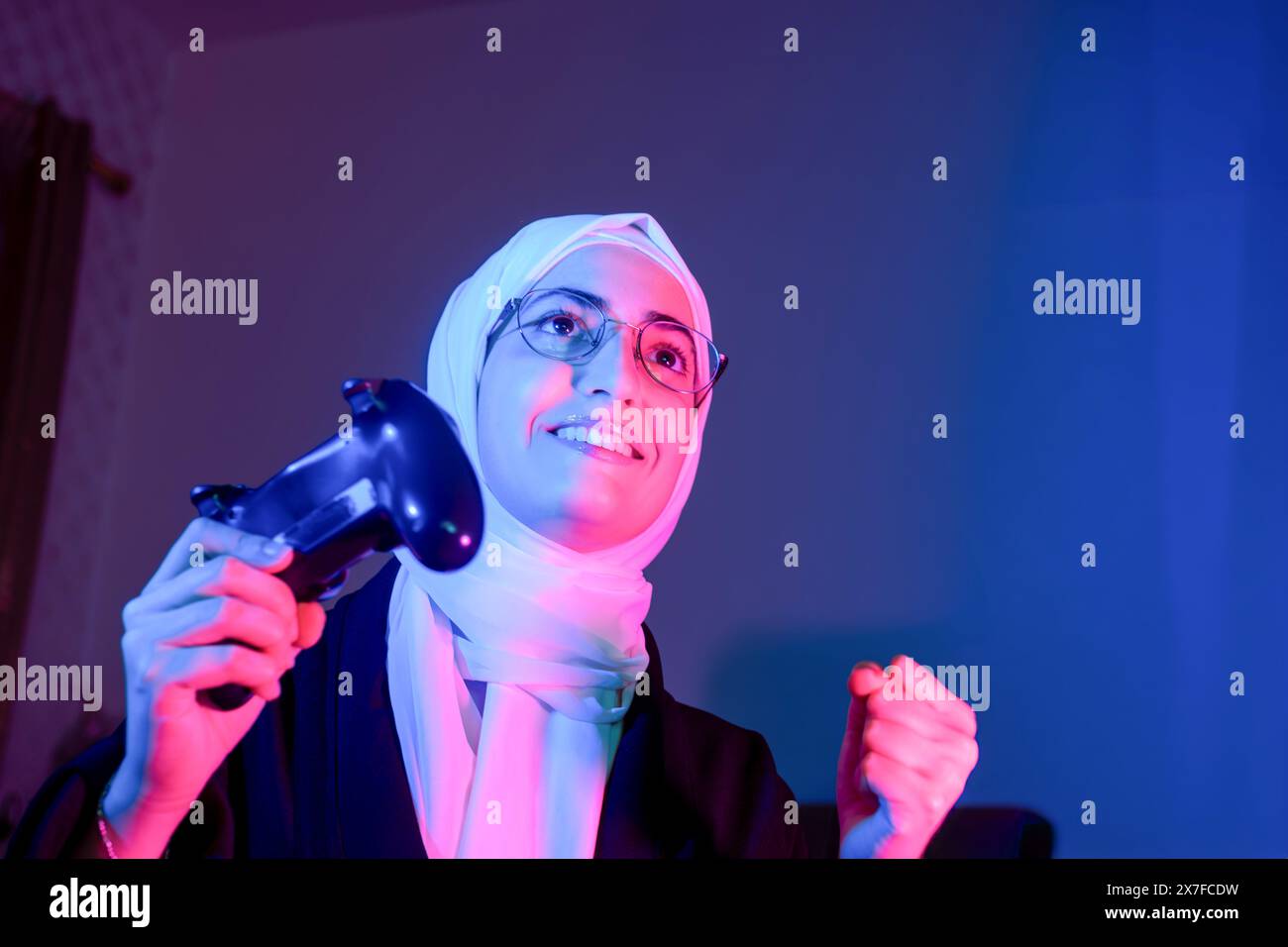 Gamer, headphones and portrait of woman in home at night in neon light ...