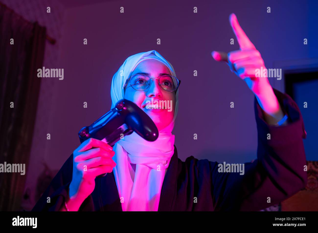 Gamer, headphones and portrait of woman in home at night in neon light ...